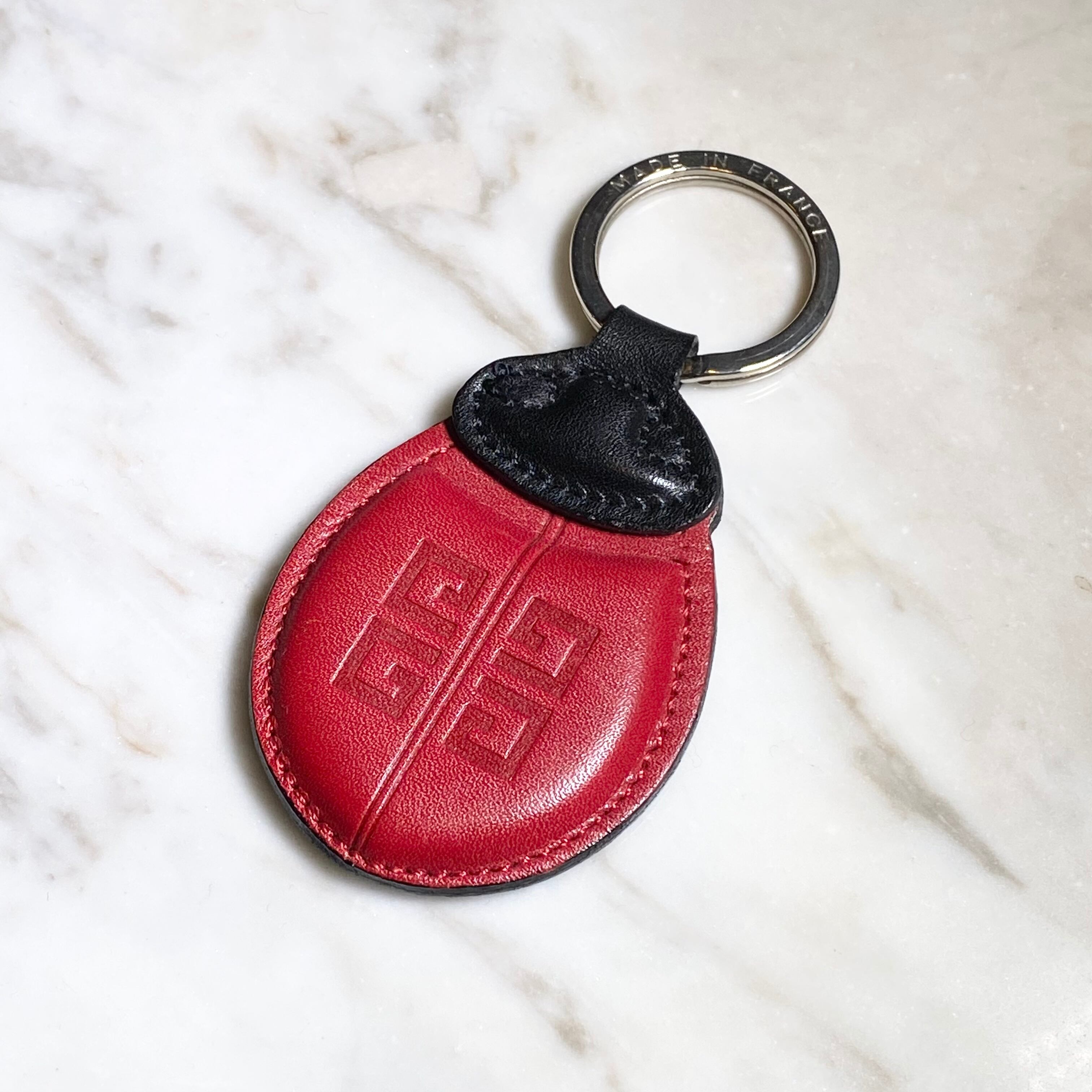GIVENCHY logo leather charm key holder | NOIR ONLINE